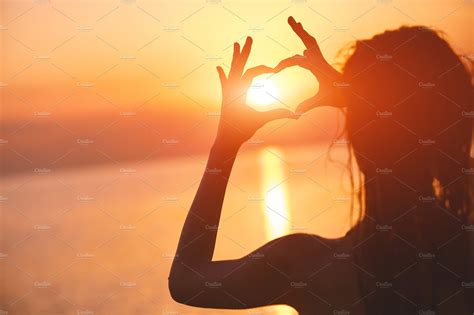 Silhouette Of A Beautiful Sexual Girl Against The Sea And Sunset