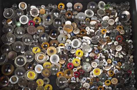A Collection Of Glass Taxidermy Eyes Of Various Sizes And Designs