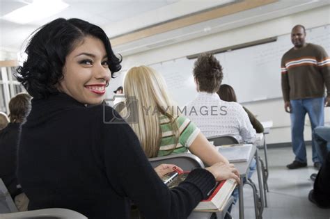 Portrait Of Young College Student With Classmates Attending Lecture By Portrait Of Young College Student With Classmates Attending Lecture By