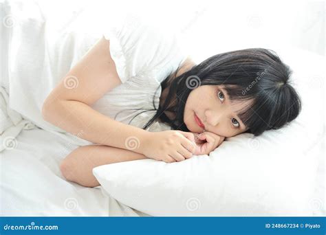 Beautiful Young Asian Woman Sleeping On Bed Relaxing In The Morning