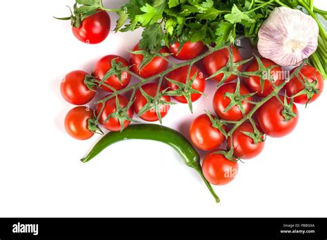 Tomatoes Green Peppers And Other Vegetables On A White Background