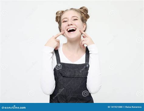 Portrait Of Beautiful Cheerful Girl Smiling Laughing Looking At Camera