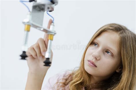 Girl Caucasian Education Electronic Robotic Arm On Table At Class Room