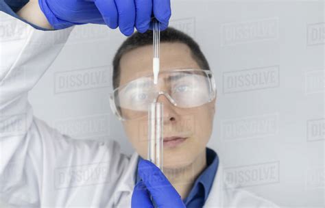 Medical Laboratory Assistant Checks A Test Tube With Sperm Spermogram Male Fertility Test