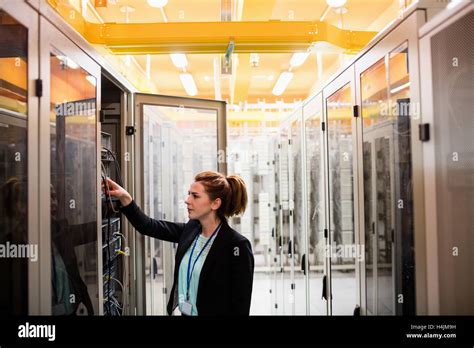Technician Examining Server Stock Photo Alamy