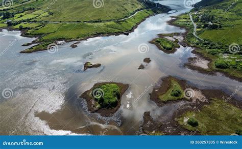 Aerial Of Killary Fjord With Muddy Waters Surrounded By Green Mountains