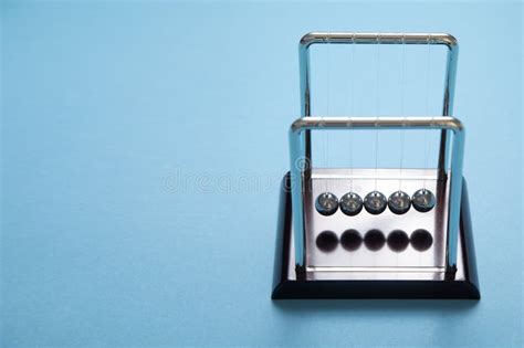 Newton S Cradle Balls On The Blue Background Stock Image Image Of Ball Physics