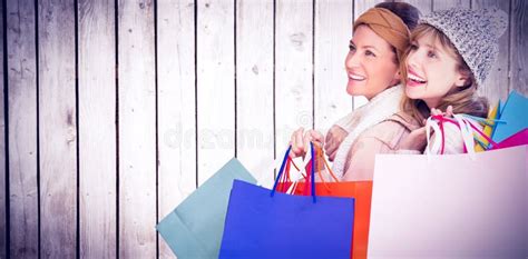 Composite Image Of Beautiful Women Holding Shopping Bags Looking Away