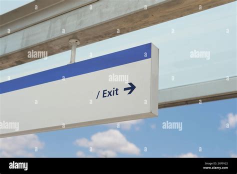 Clear Signage Indicating Exit Direction At Transportation Facility For Better Passenger