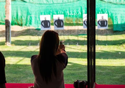 Premium Photo Woman Practice Shooting Pistol