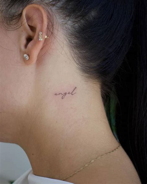 Lettering Tattoo Of The Word Angel Handwritten On The