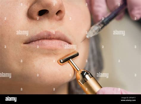 Contour Plastic A Cosmetologist Injects A Botulinum Toxin To Tighten