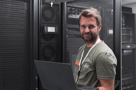 premium photo data center engineer using laptop computer server room