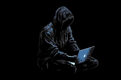 Premium Photo Hacker In A Hoodie Sitting At His Computer