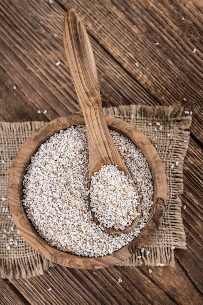 Premium Photo Wooden Table With A Portion Of Puffed Amaranth Selective Focus
