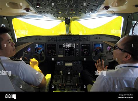 File Chinese Pilots Talk In The Cockpit Of A Chinese Made Arj21