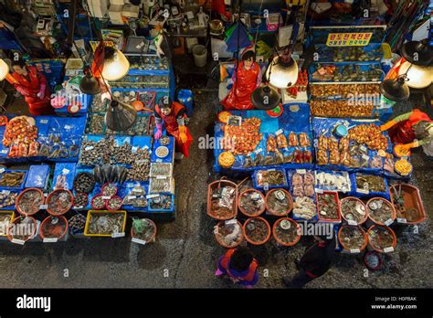 Saleswomen And Seafood Being Sold At The Or Noryangjin Fish Market In