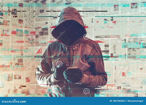 Hooded Hacker With Mask Typing On Virtual Keyboard Stock Image