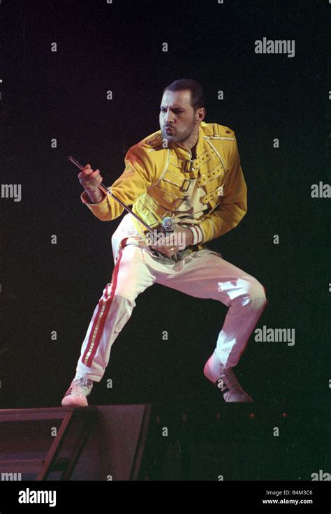 Freddie Mercury Of Queen On Stage During Concert At Wembley Stadium London Air Guitar Performing