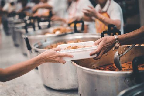 Homeless People Receive Delicious Charity Food From Volunteers Concept