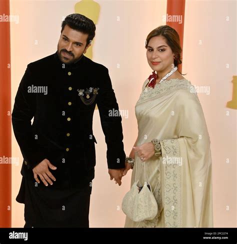 L R Ram Charan And Upasana Kamineni Attend The 95th Annual Academy