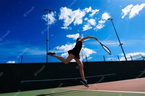 Premium Photo Sexy Girl Tennis Player Holding Tennis Racket On The Court Young Woman Is