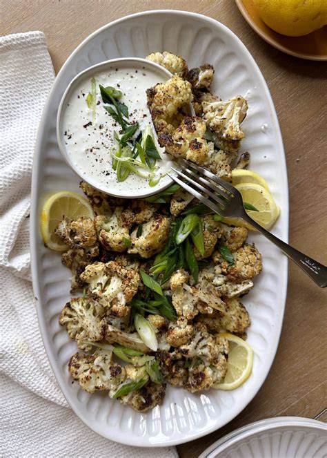 Lemon Pepper Cauliflower Wings with Garlic Feta Dipping Sauce - Laura Loves to Cook