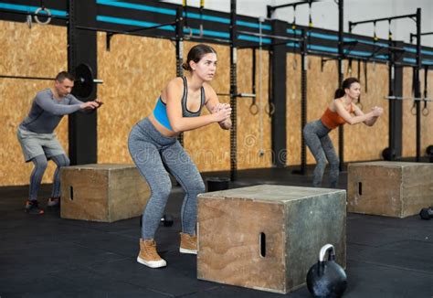 Girl Performs Exercises Squats Hill Climbing Kettlebell Squats Using