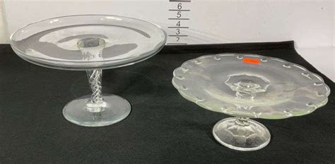 2 Glass Pedastal Cake Display Stand One Has A Beautiful Swirl Base Hash Auctions