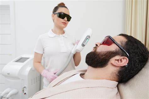 Premium Photo Man Getting A Laser Hair Removal On His Face At