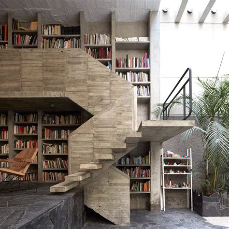 Apartment In Paris By Schemaa Features A Staircase Made Of Cupboards