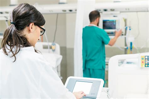 Medical Assistant Working With The Medical Technology Equipment Stock