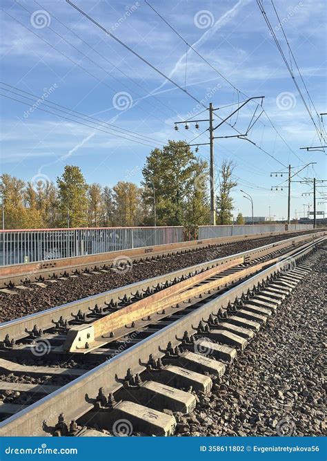 Railway Tracks With Overhead Power Lines On Sunny Day Old Train Tracks With Railroad Switch