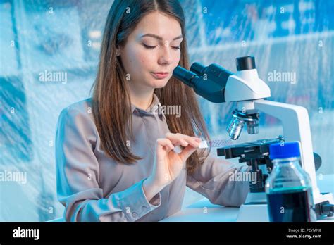 Girl With A Slide For The Microscope University Hospital Stock Photo Alamy