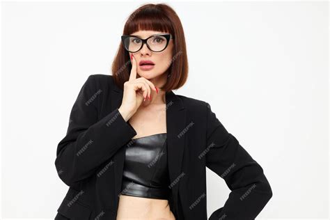 Premium Photo Portrait Of A Woman Posing With Glasses A Leather Suit