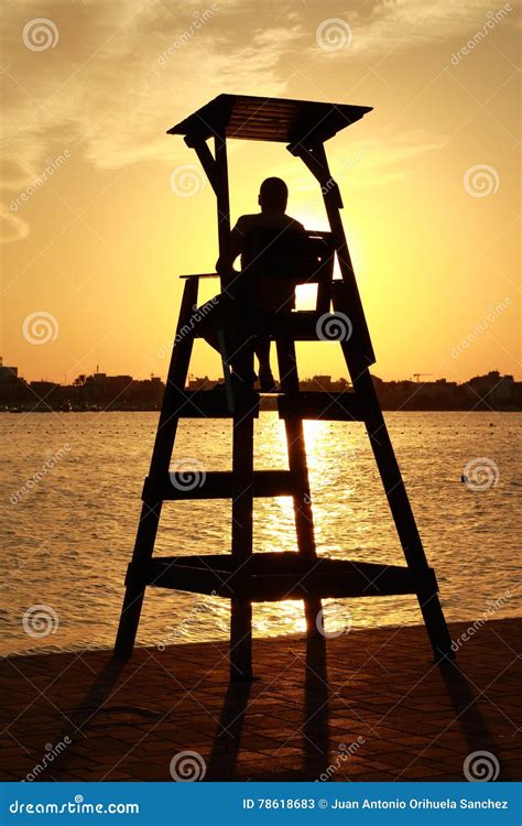 Silhouette Of A Lifeguard At Sunset Stock Image Image Of Lifeguard
