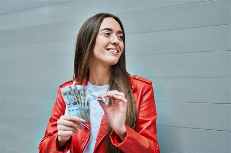 Free Photo Young Hispanic Woman Smiling Happy Counting Peruvian Sol