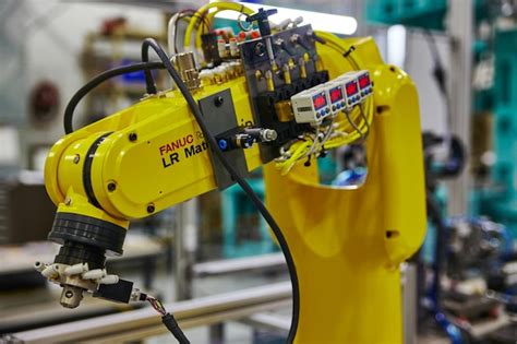 Premium Photo Industrial Robot Arm In Factory Setting Closeup