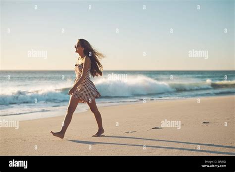 Walk Where Your Heart Leads You A Young Woman Taking A Stroll On The