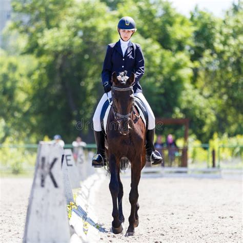 Young Equestrian Girl Performing Her Dressage Test in Equestrian ...