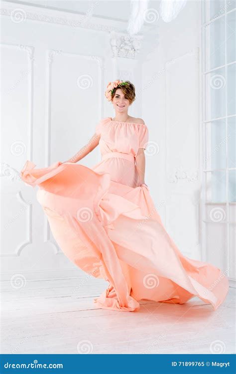 Pregnant Woman Dancing In Pink Evening Dress Flying On Wind Waving