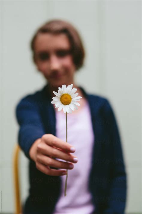 Girl Holding Daisy Flower By Stocksy Contributor Rialto Images