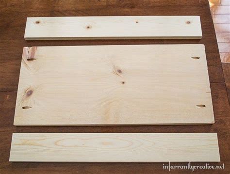 Two Pieces Of Wood Sitting On Top Of A Wooden Table Next To Each Other