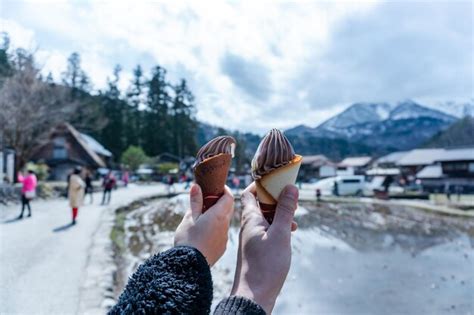 Premium Photo Cropped Hands Of People Holding Ice Cream Cones