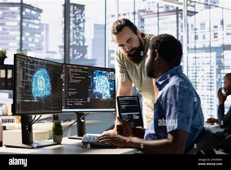 It Staff Members Testing And Deploying Artificial Intelligence Programs And Systems Team Of