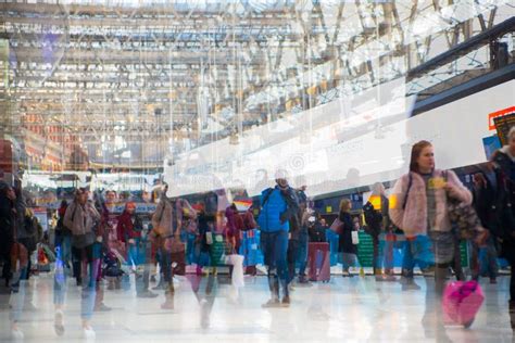 multiple exposure image of lots of people walking and waiting for