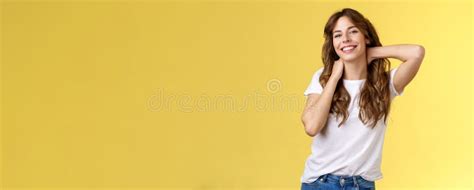 Cheerful Charismatic Good Looking Curly Haired Woman Stretching Posing