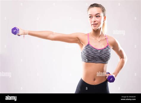 Portrait Of Young Happy Smiling Woman In Sportswear Doing Fitness