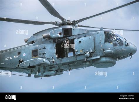A Royal Navy Merlin Mk2 Anti Submarine Warfare Helicopter Hovering Over