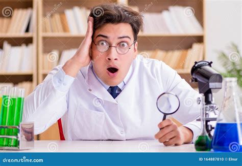 Mad Crazy Scientist Doctor Doing Experiments In A Laboratory Stock